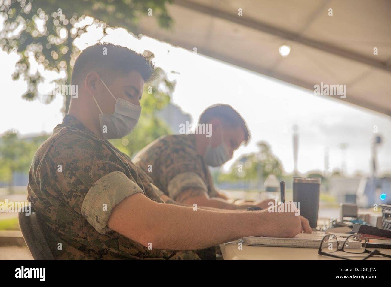U.S. Navy Petty Officer 2nd Class Donald Irwin, left, and U.S. Navy ...