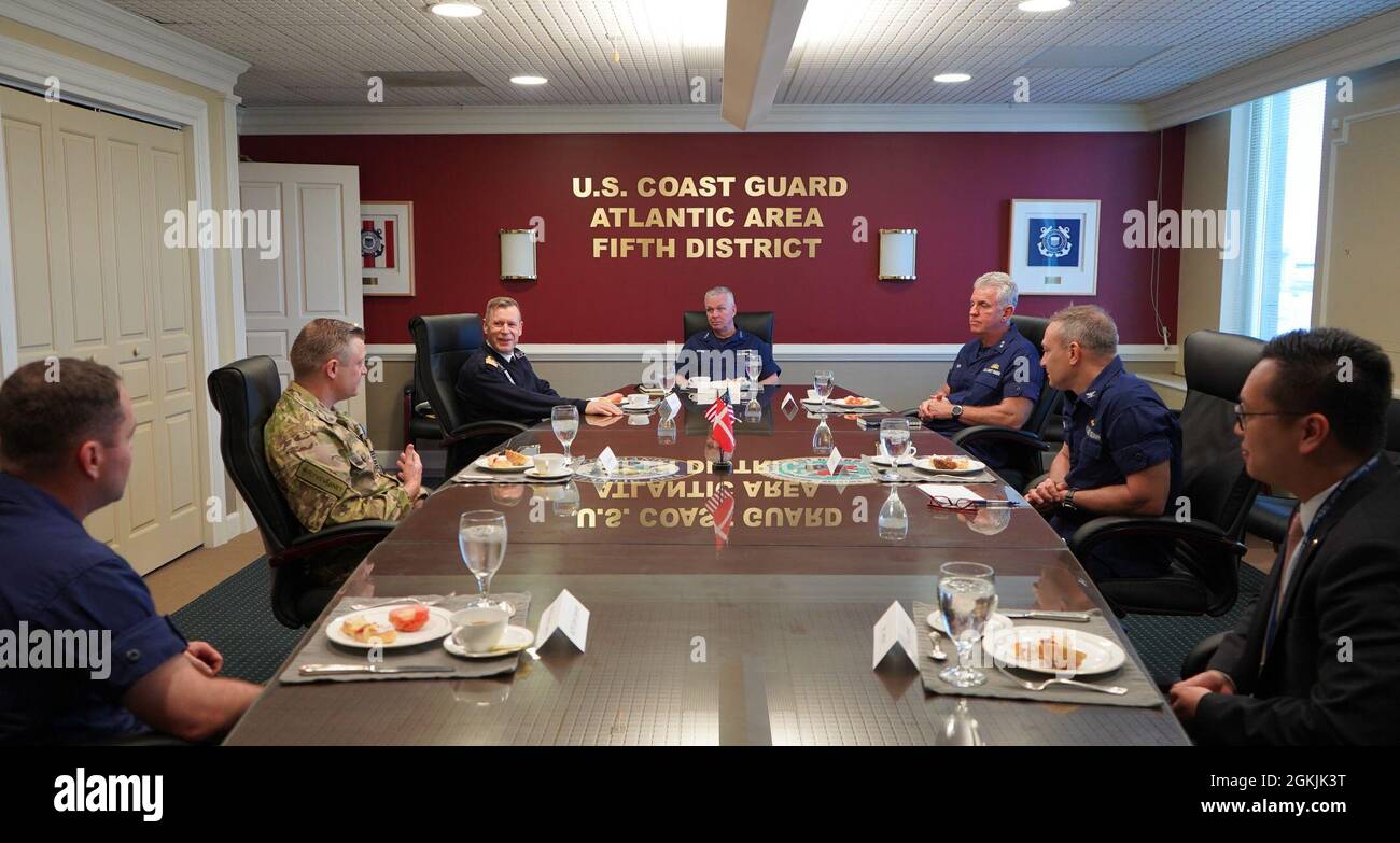 Vice Adm. Steven Poulin, commander of the Coast Guard Atlantic Area Command, meets with Rear Adm ...