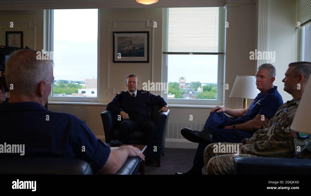 Vice Adm. Steven Poulin, commander of the Coast Guard Atlantic Area Command, meets with Rear Adm ...