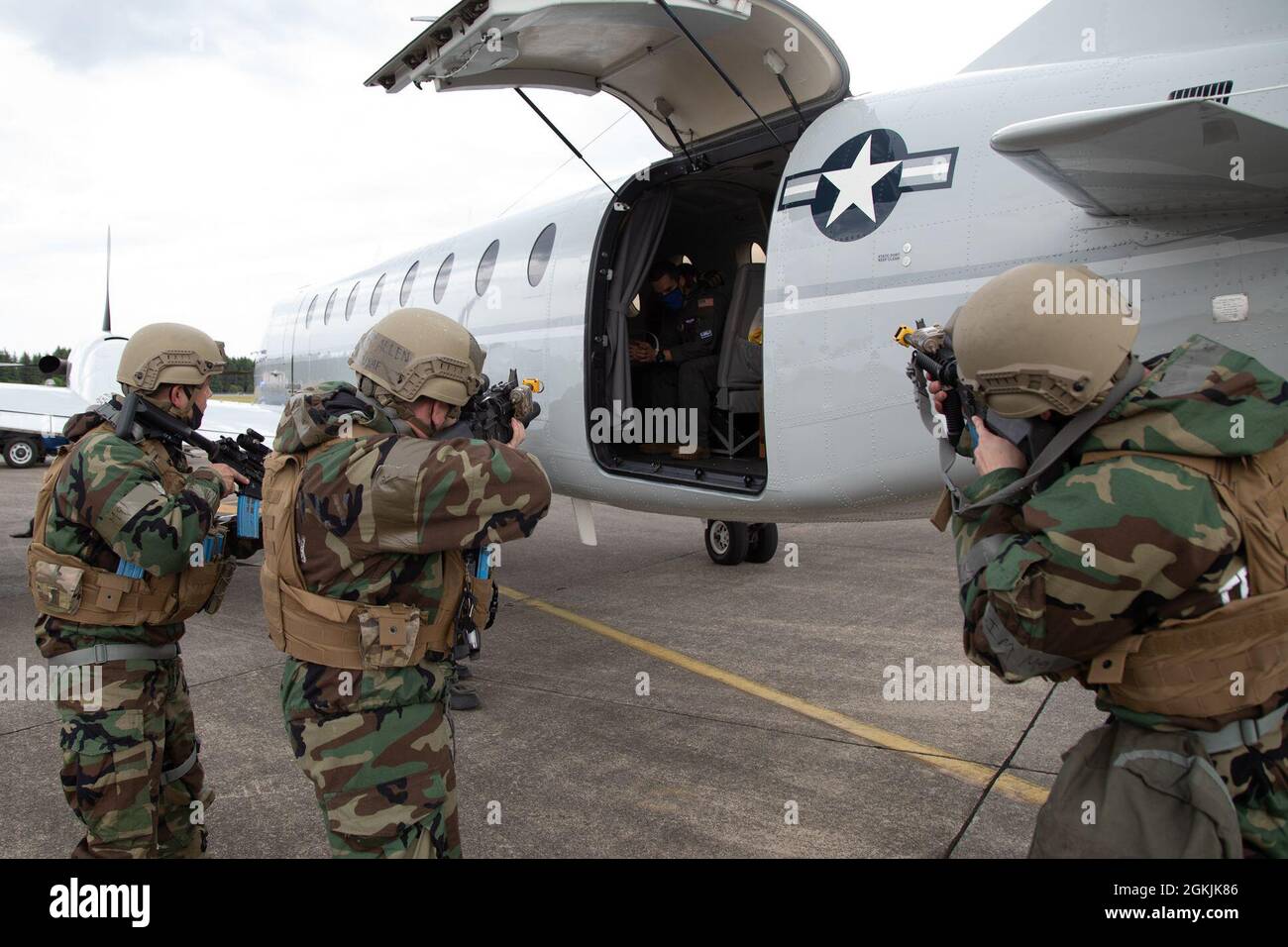 Patrolmen with the 374th Security Forces Squadron surround a simulated ...