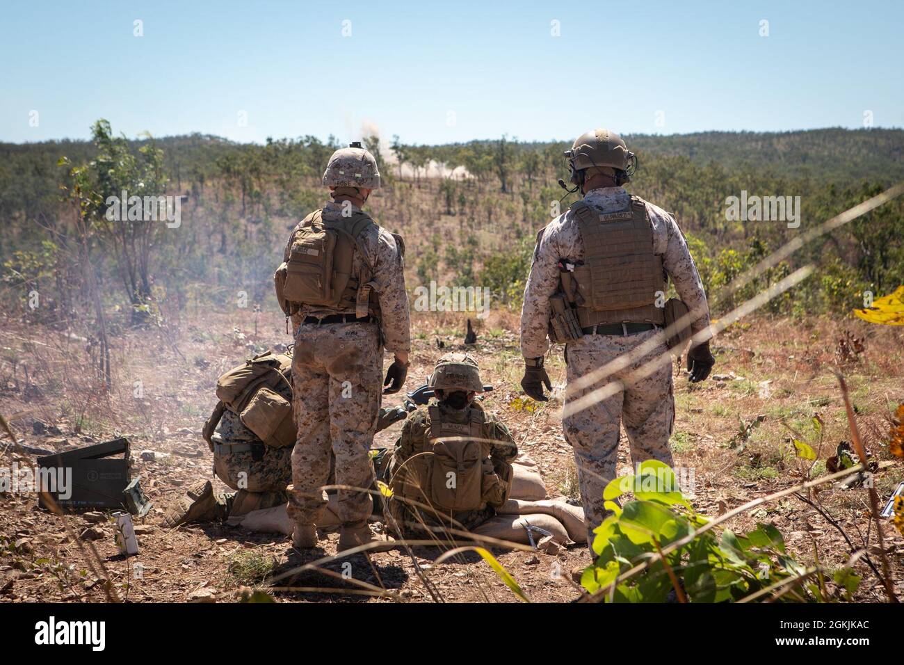 U.S. Marine Corps Sgt. Joseph Rose, left, a machine gun squad leader ...