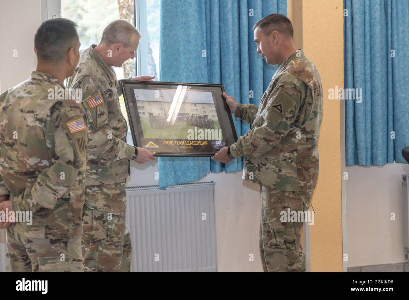 U.S. Army Brig. Gen. Christopher Norrie receives a gift during his ...