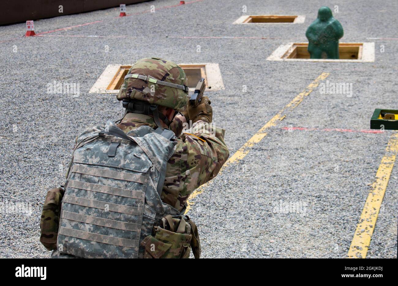 A U.S. Soldier assigned to Regional Command-East, Kosovo Force, fires a ...
