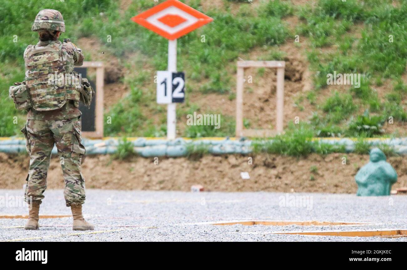 A U.S. Soldier assigned to Regional Command-East, Kosovo Force, fires a ...