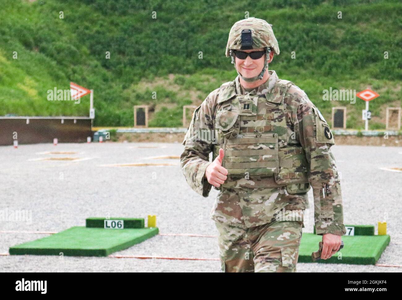 A U.S. Soldier assigned to Regional Command-East, Kosovo Force, gives a ...