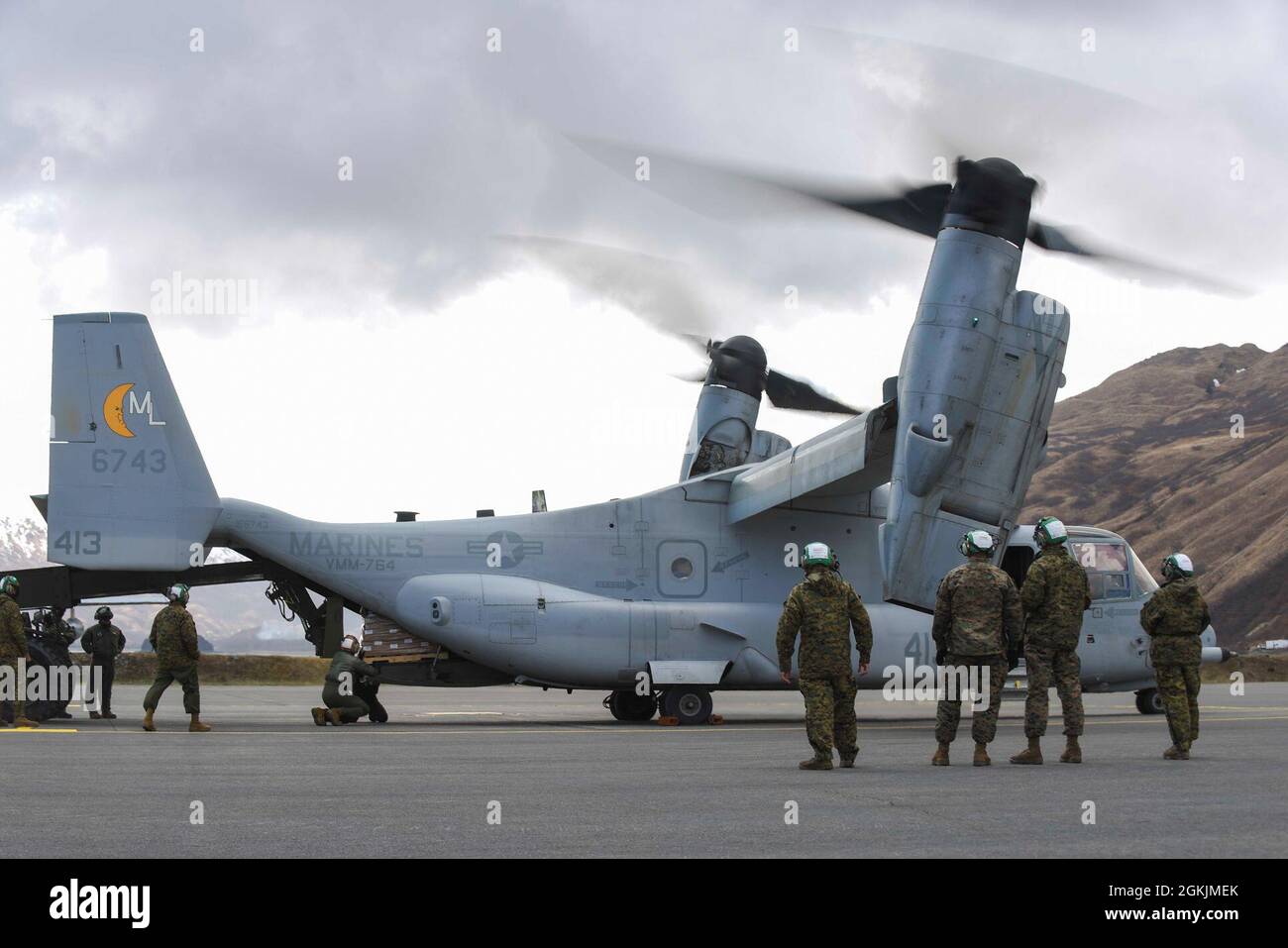 U.S. Marines prepare and observe an MV-22 Osprey before takeoff May 5 ...