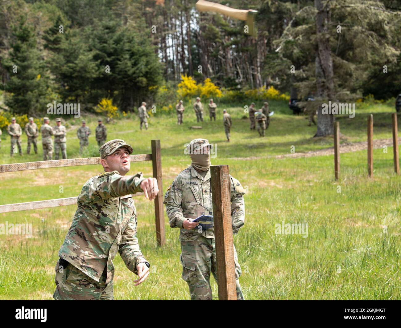 South Dakota Army National Guard Sgt. Mackenzie Harvey tosses a hatchet ...