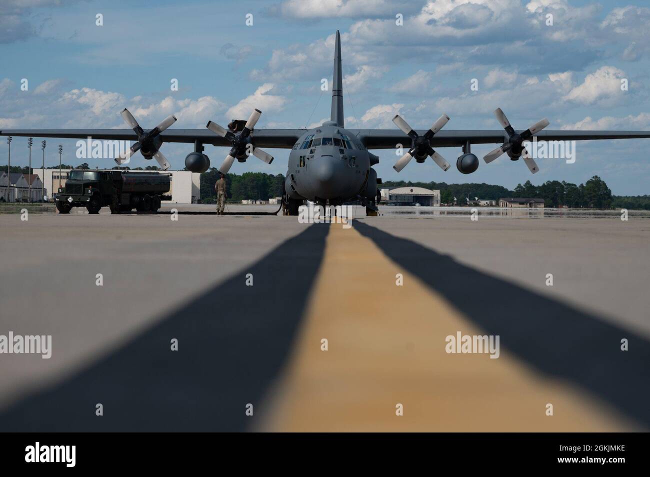 A C-130 supporting DEFENDER-Europe 21 sits on the flightline at Pope ...