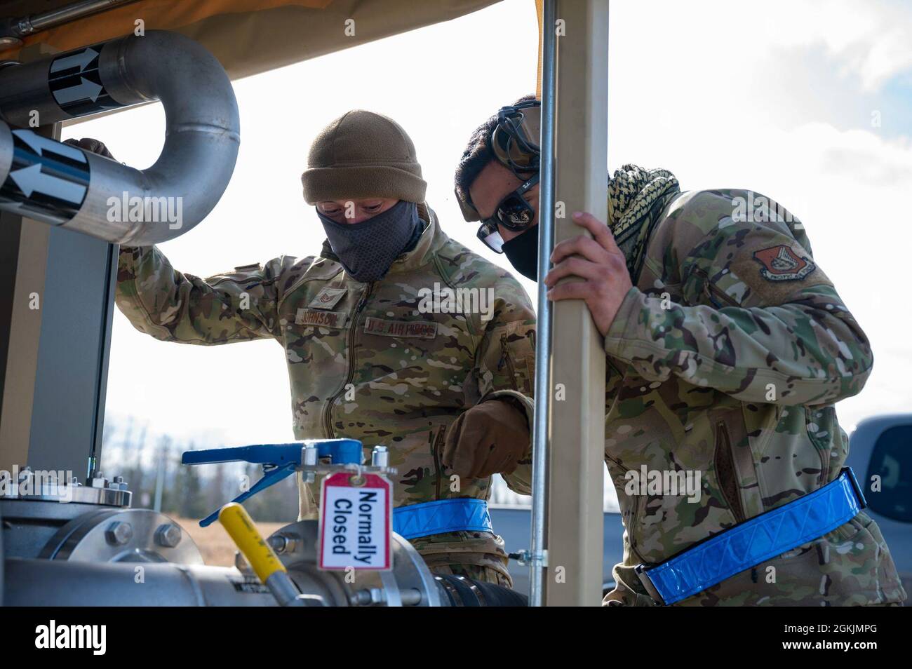 U.S. Air Force Tech. Sgt. Todd Johnson, left, a 36th Contingency ...