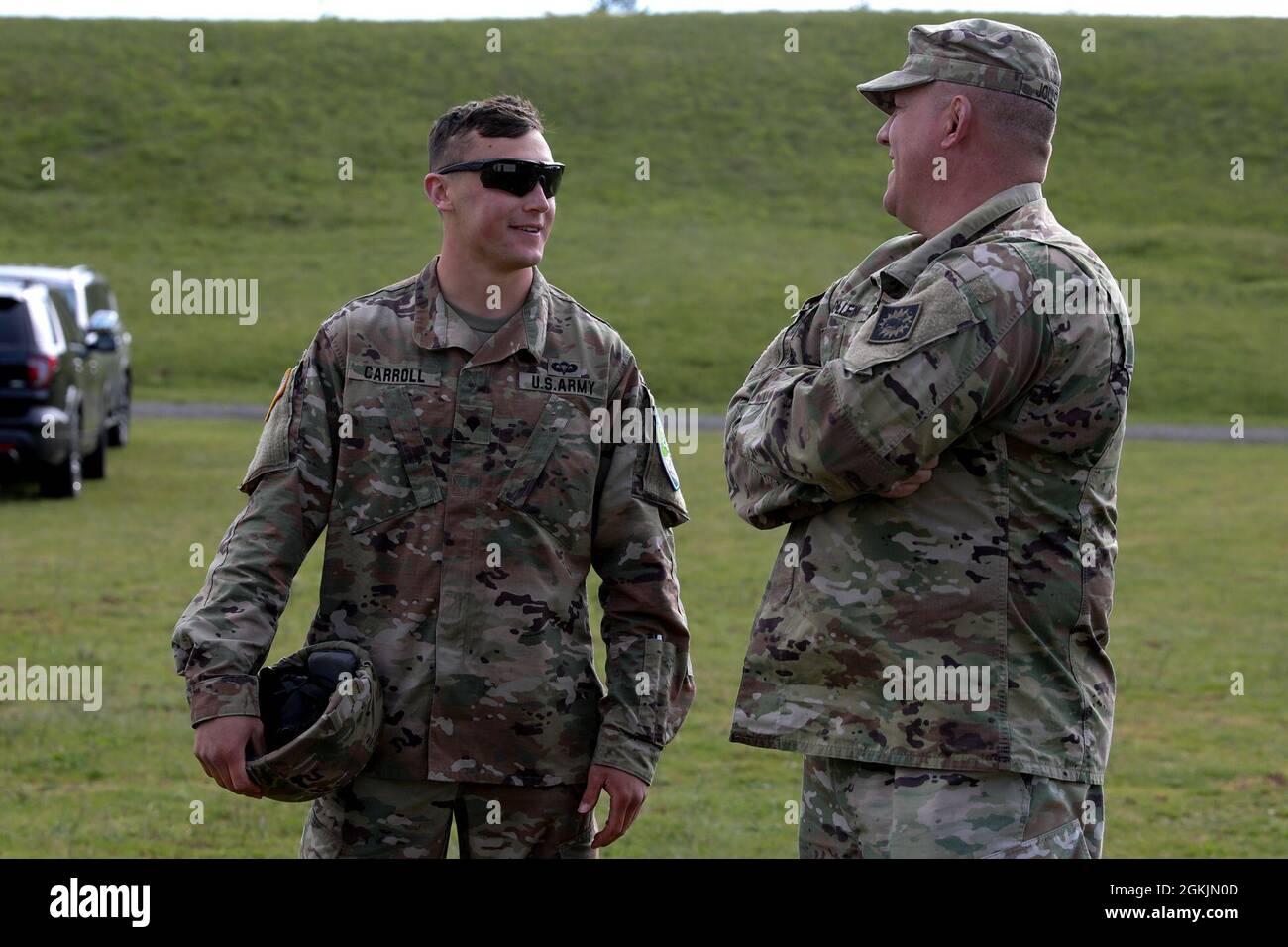 U.S. Army Spc. Aiden Carroll (left), a Horizontal Construction Engineer ...