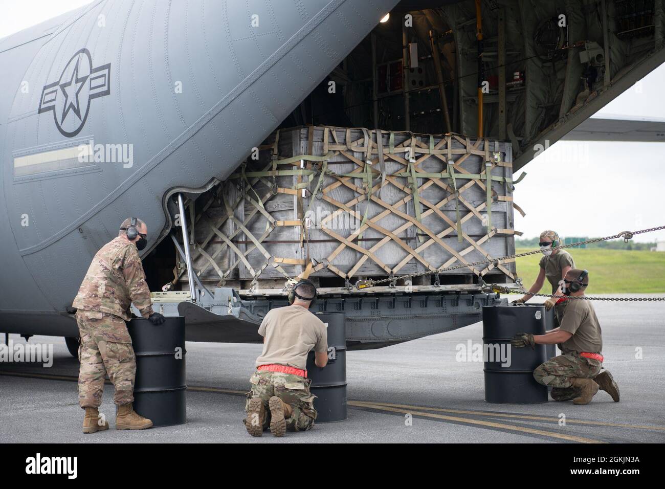 Airmen from the 18th Logistics Readiness Squadron position barrels ...