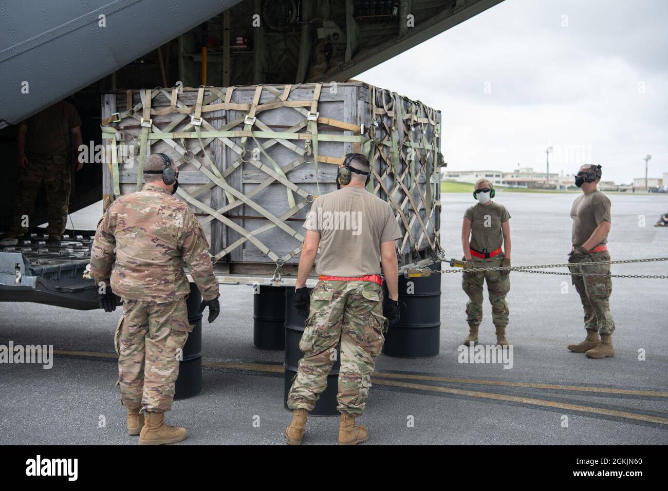 Airmen from the 18th Logistics Readiness Squadron position barrels ...