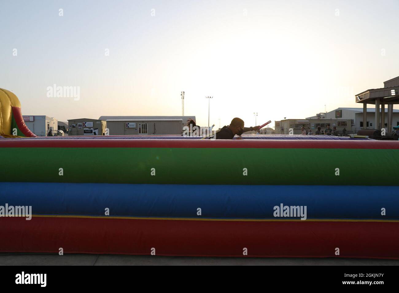 Soldiers tried their best to stick a baton stuck on the end of a Velcro ...