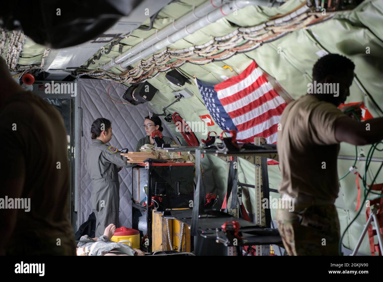 U.S. Air Force Maj. Kati Joen, left, a mission clinical coordinator ...
