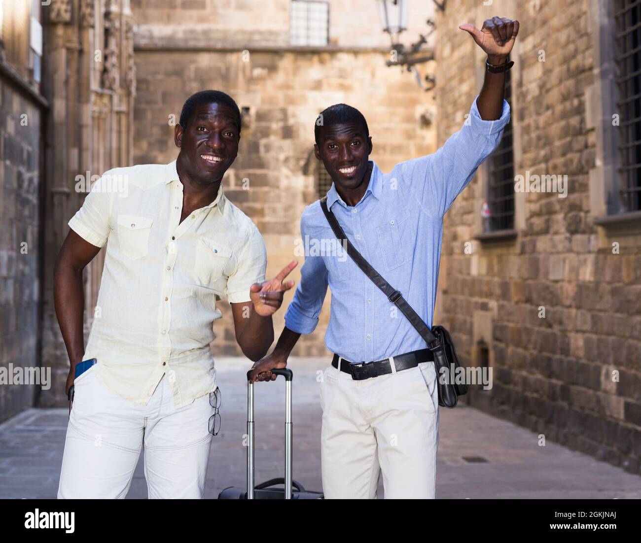 Smiling two tourists luggage standing hi-res stock photography and ...