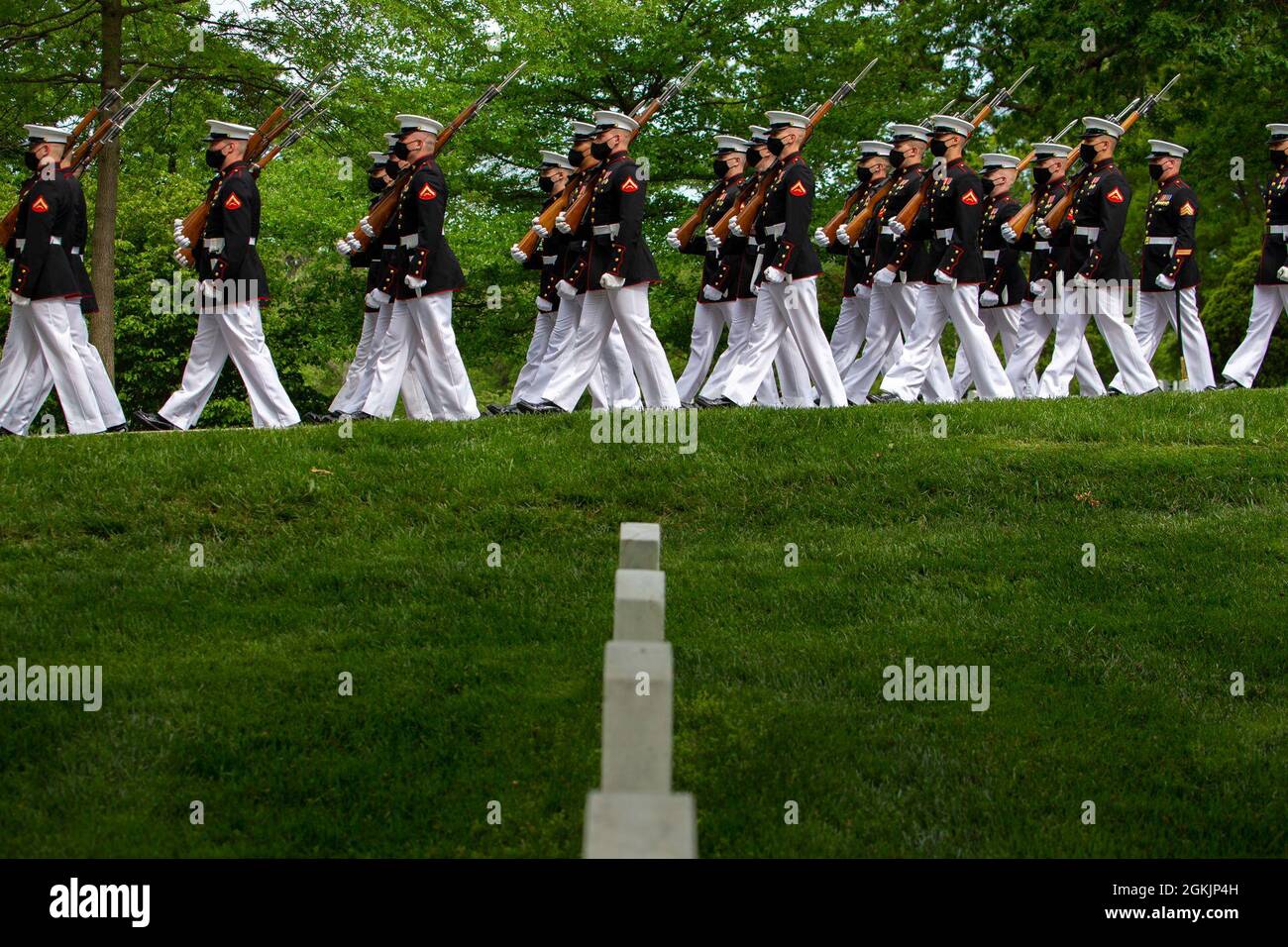 Marines from Marine Barracks Washington march in formation during a ...