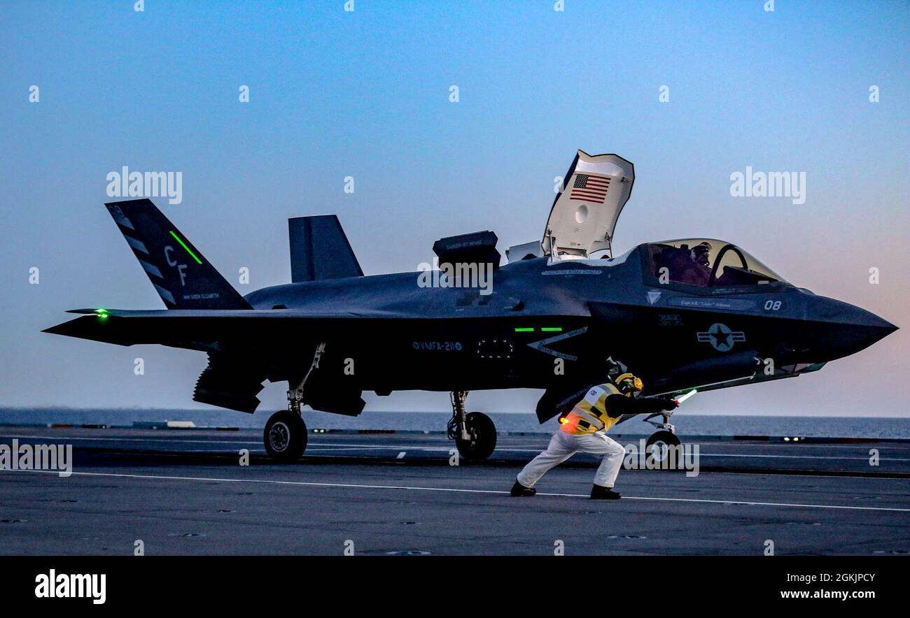 A Marine with Marine Fighter Attack Squadron (VMFA) 211, Carrier Strike ...