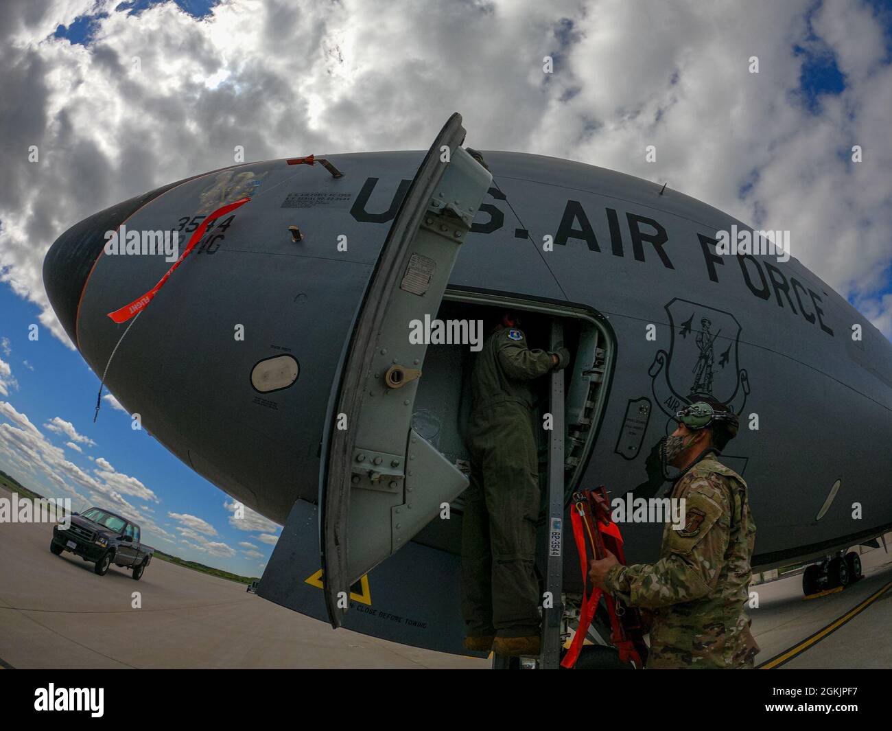 U.S. Air Force Lt. Col. Jason Miller and maintenance crew members check ...