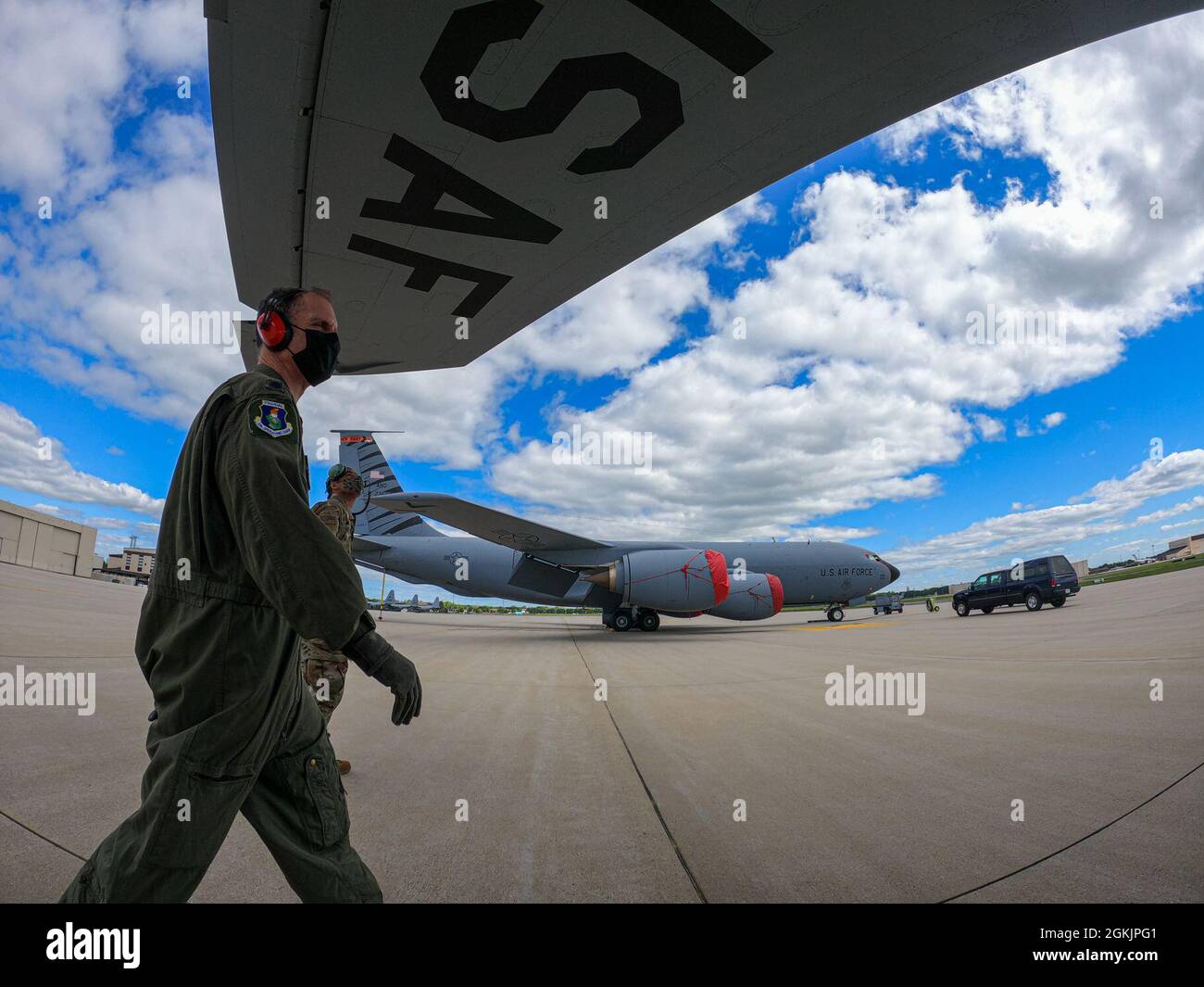 U.S. Air Force Lt. Col. Jason Miller and maintenance crew members check ...