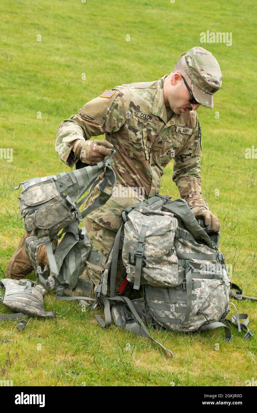 Alaska Army National Guard Sgt. Hector Colon inspects his gear during ...