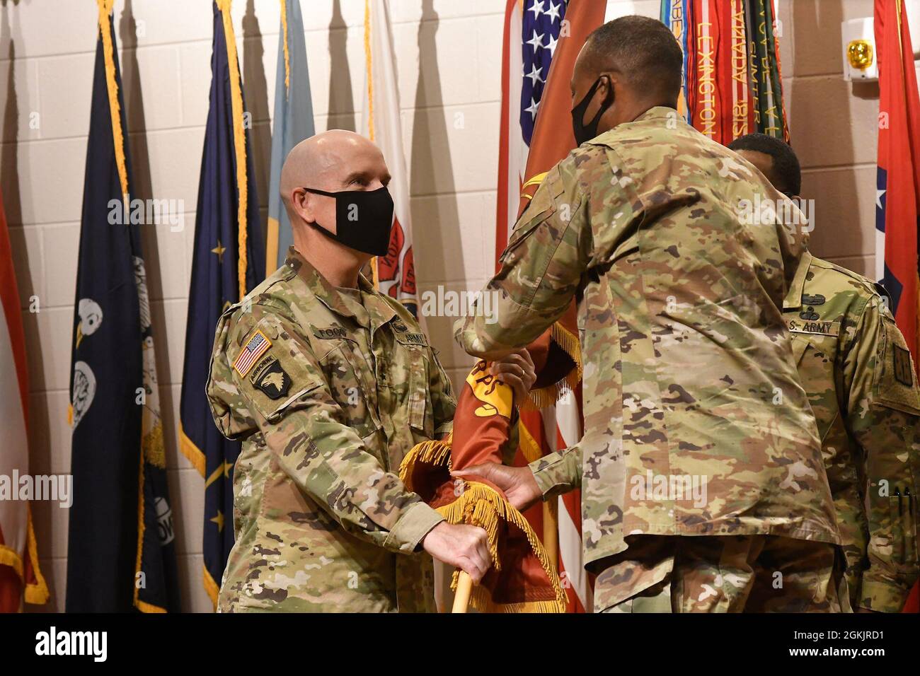 The Chief of Transportation, Brig. Gen. James M. Smith, passes the Trans. Corps’ colors to Maj ...