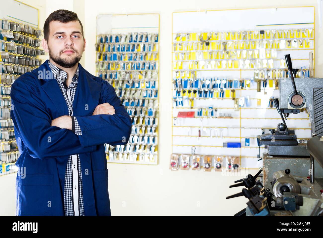 Worker displaying his tools for making keys Stock Photo - Alamy