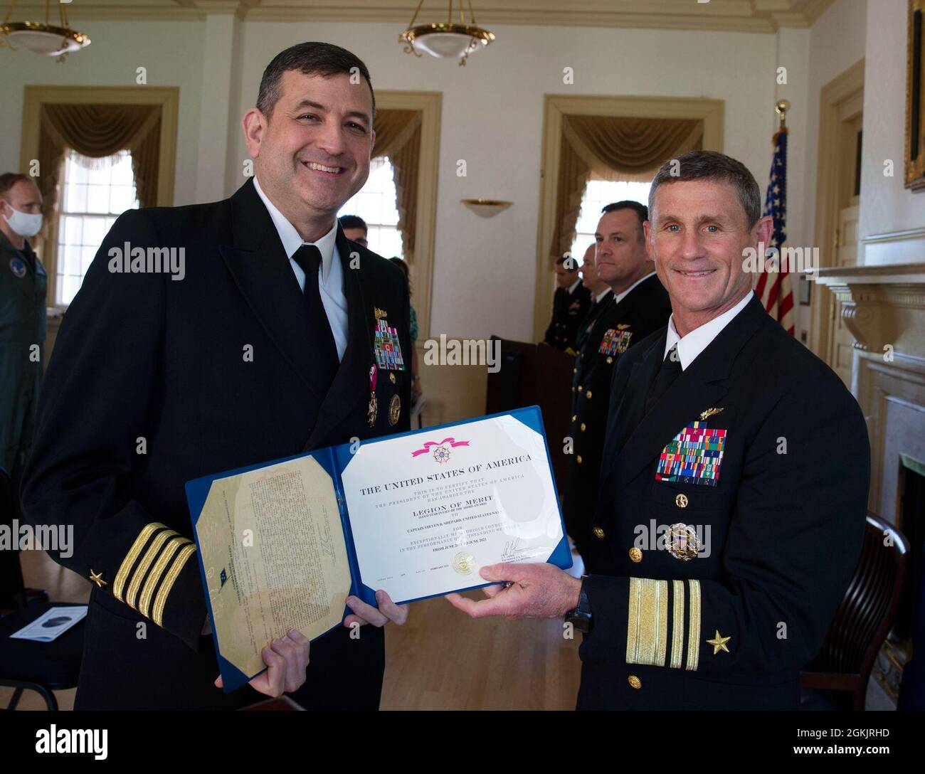 Vice Adm. Andrew Lewis, right, commander, Second Fleet, presents Capt ...