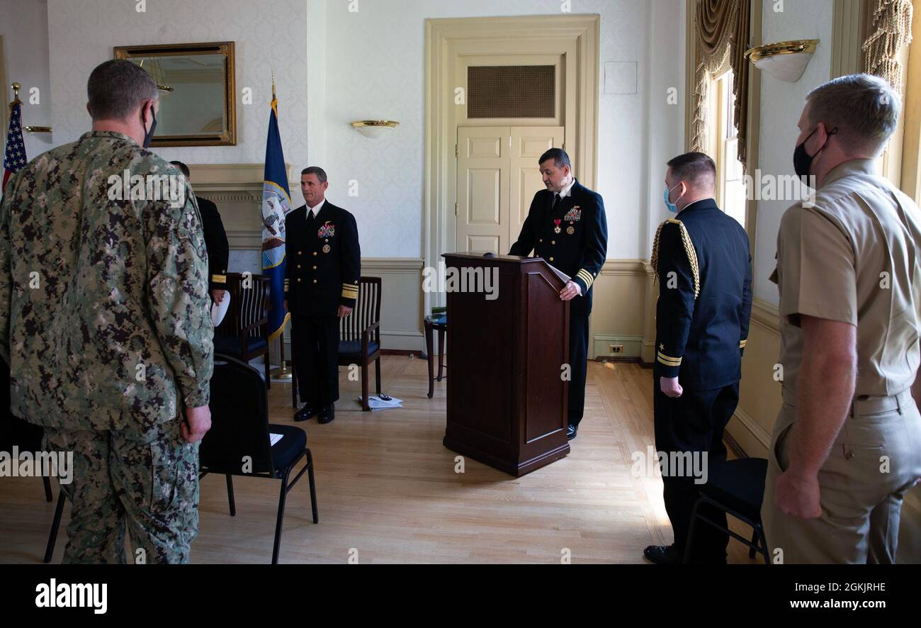 Capt. Steve Shepard, center, reads his orders during his change of ...