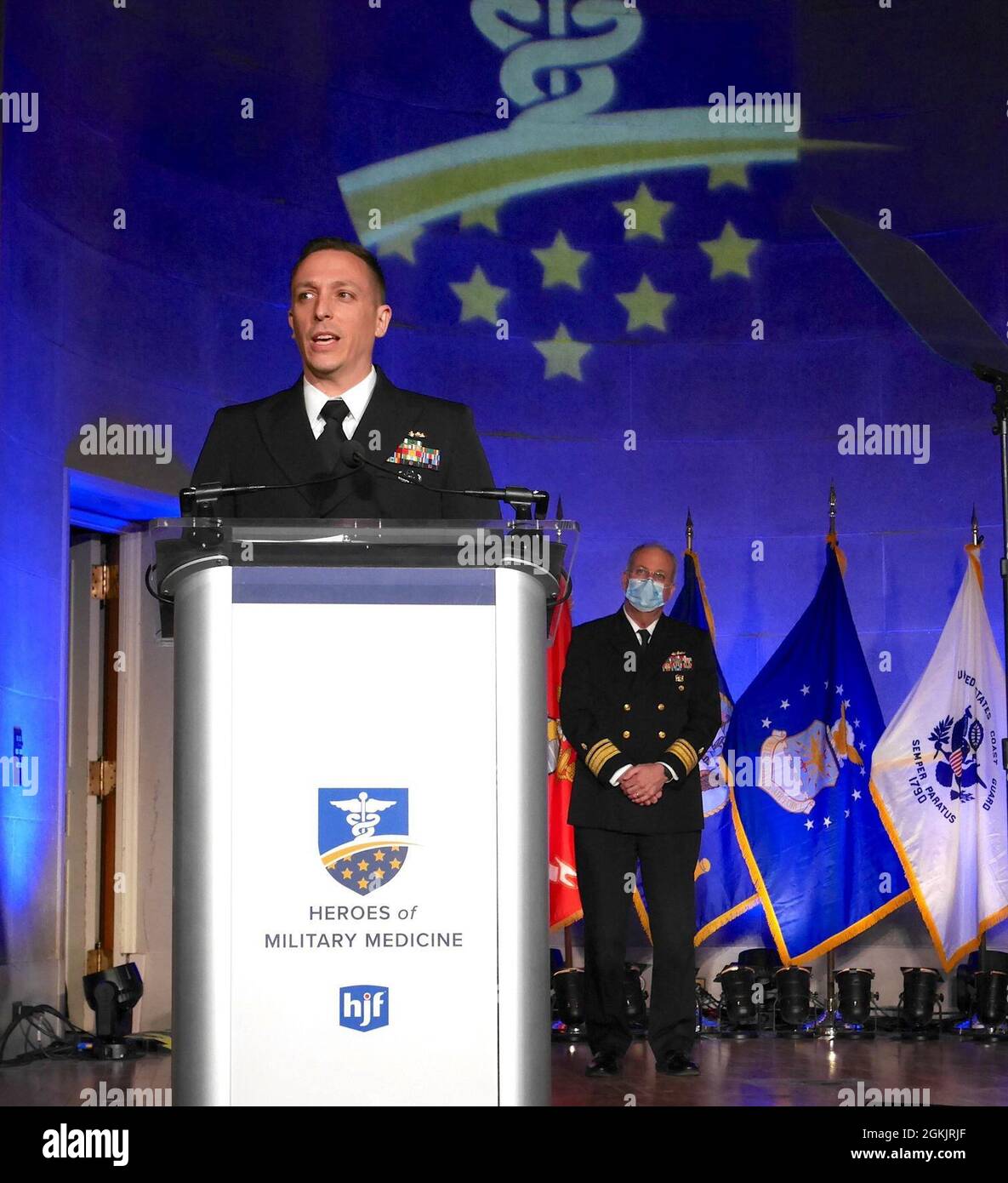 Lt. Cmdr. Matthew Hall accepts the 2021 Navy Hero of Military Medicine ...