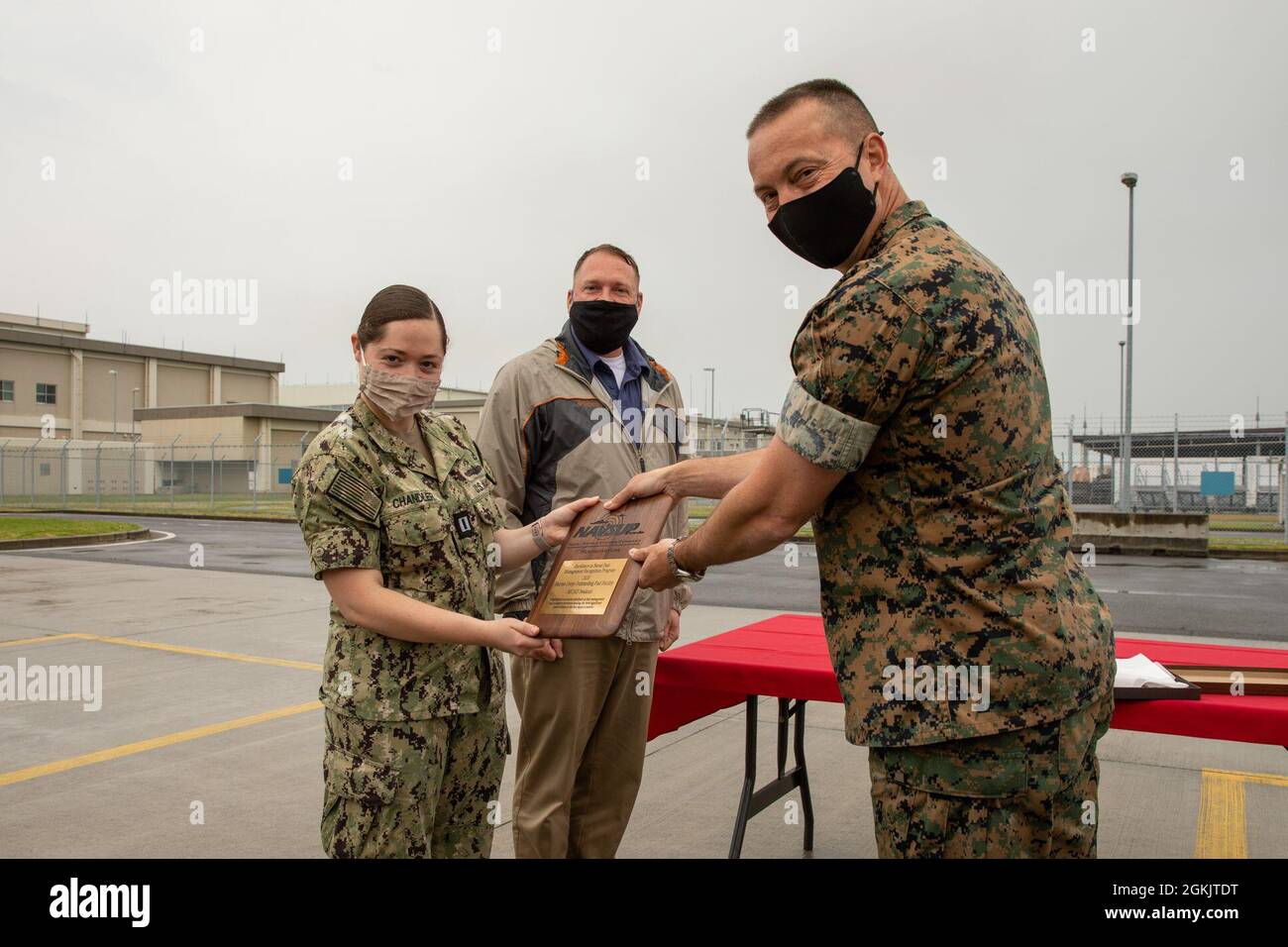 U.S. Navy Lt. Nia Chandler, left, the fuels officer with the Station ...