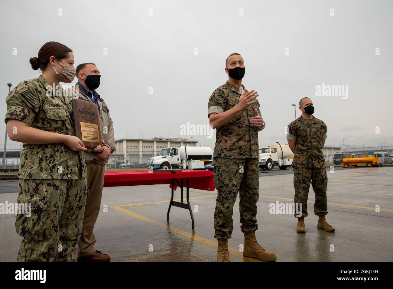 Col. Lance Lewis, center-right, commanding officer of Marine Corps Air ...