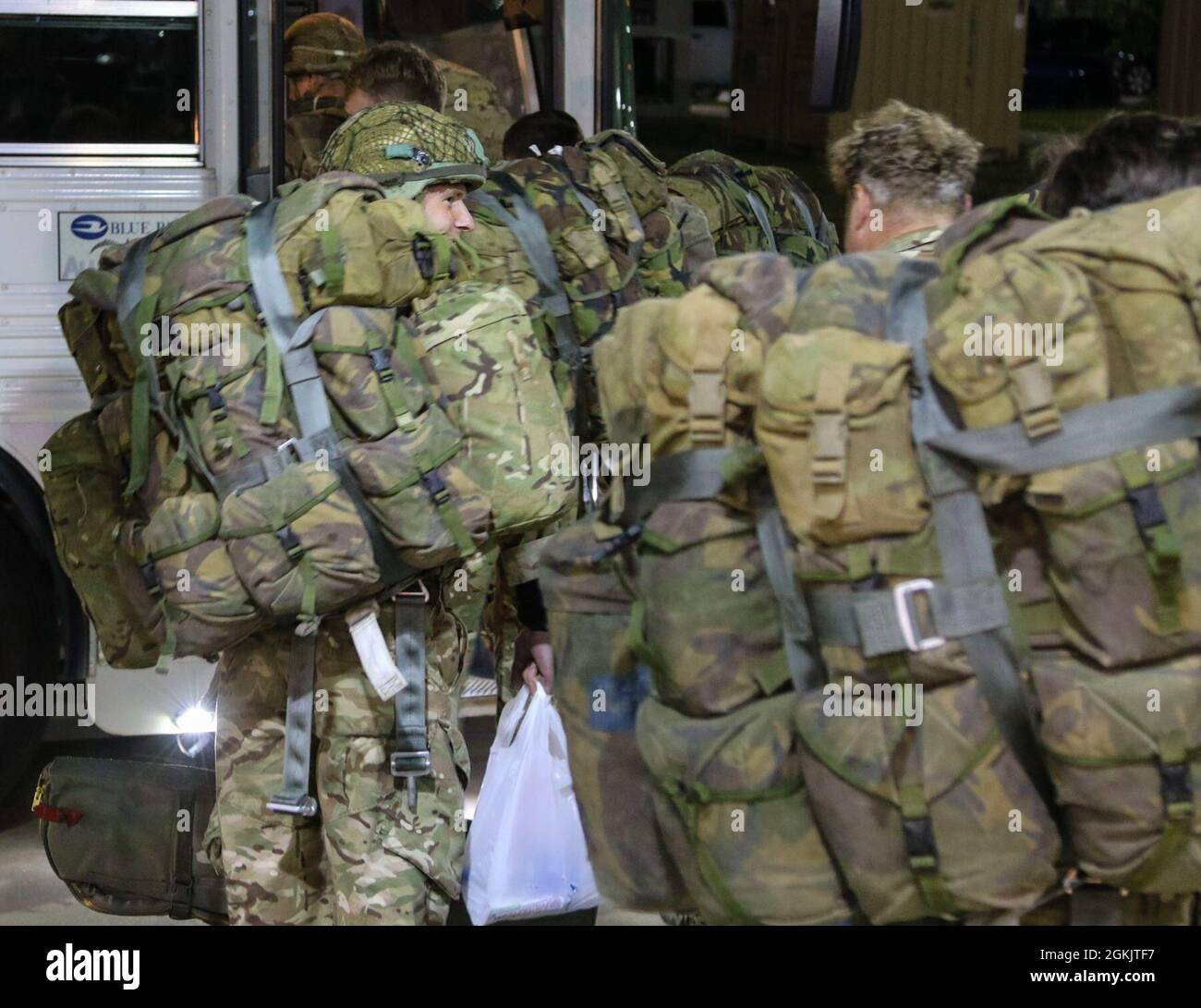 Paratroopers assigned to the 82nd Airborne Division prepare to depart ...