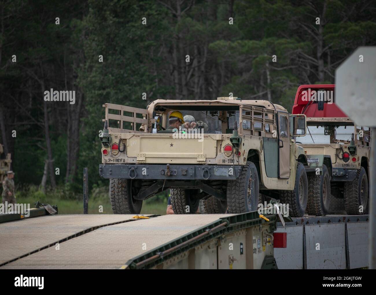 A British soldier inches a U.S. Humvee forward until his U.S ...