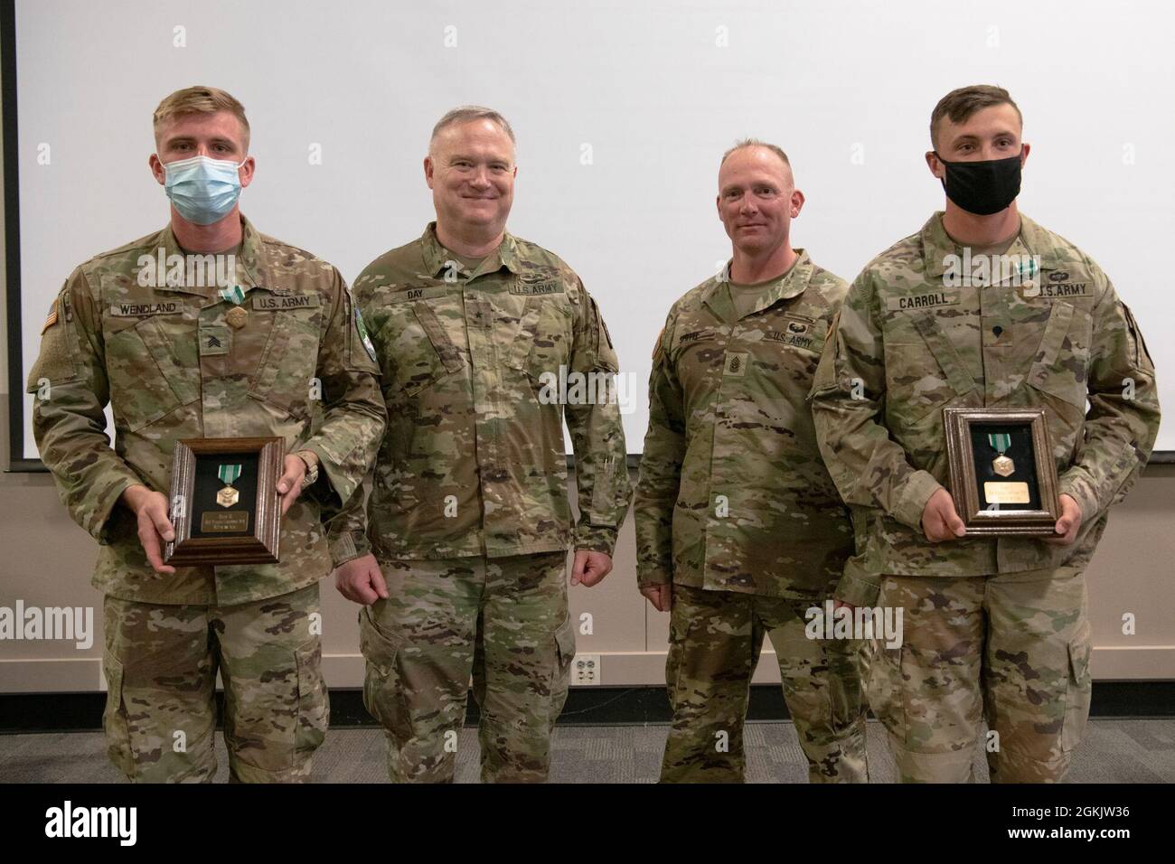 Oregon Army National Guard Brig. Gen. Gregory Day (center left) and ...