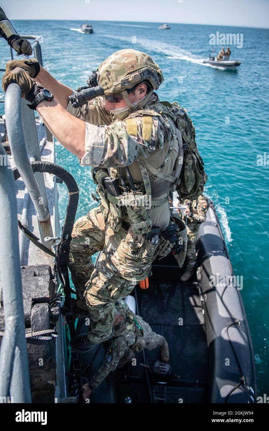 A U.S. Navy SEAL boards a vessel during a visit, board, search and ...