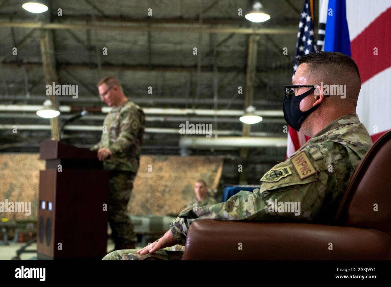Col. Brian Moore, 51st Maintenance Group commander, left, speaks at ...