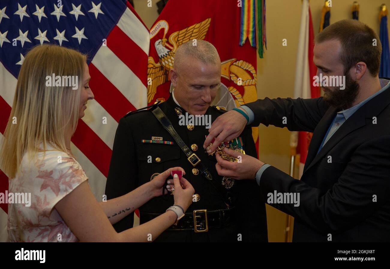 Isabel Bufton and Brian Bufton award the Legion of Merit to U.S. Marine ...