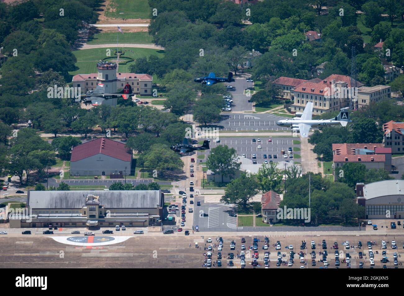 Historic World War II bombers fly over the flightline during the ...