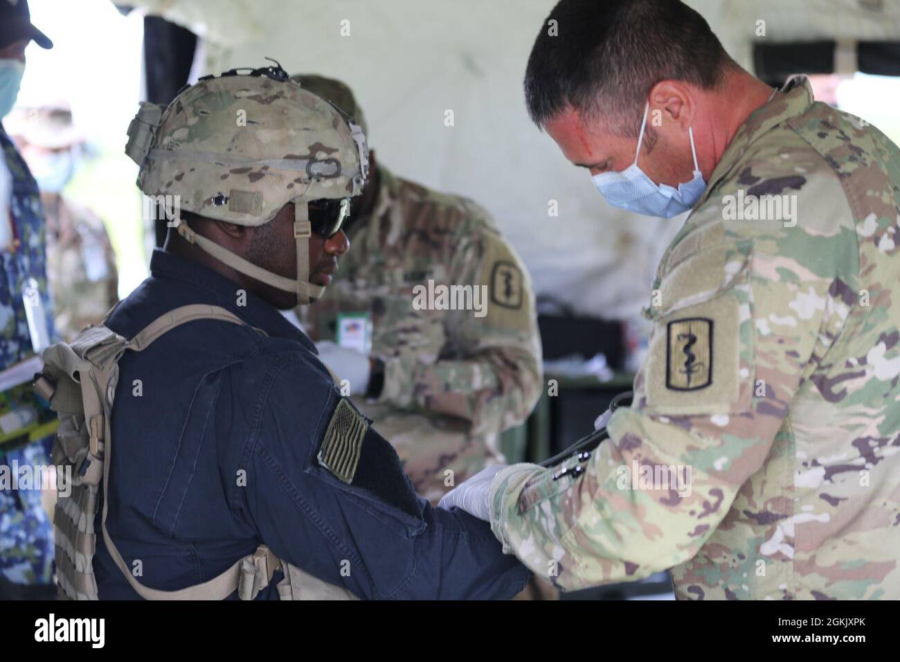 U.S. Army Soldiers assigned to the 30th Medical Brigade treat injury ...