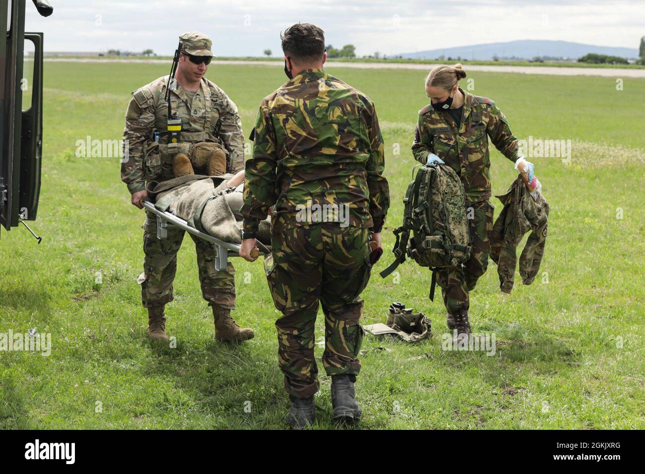 U.S. Army Soldier and soldiers from the Netherlands conducts medavac ...