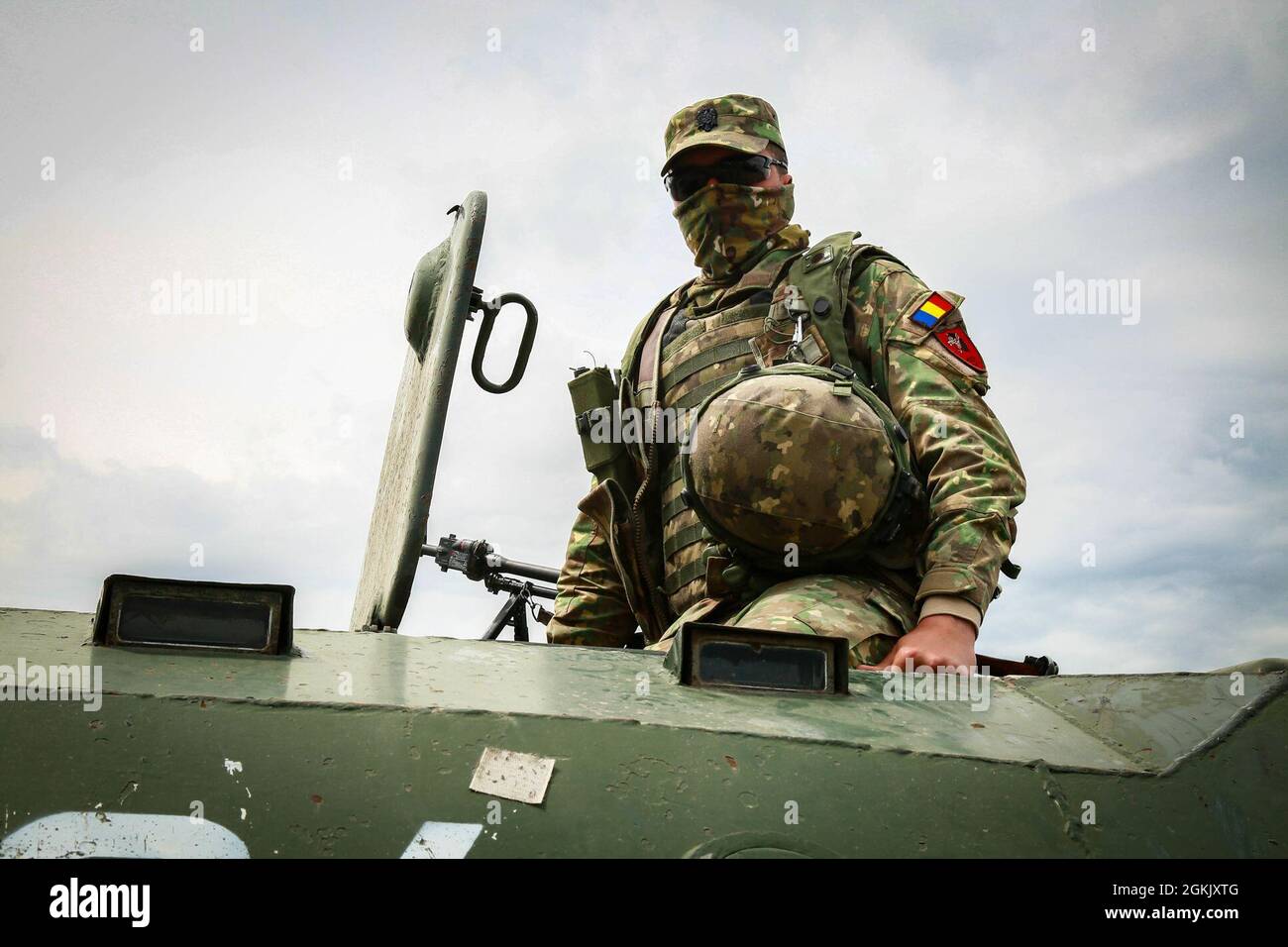 A Romanian soldier assigned to the Black Wolves, 151st Infantry ...
