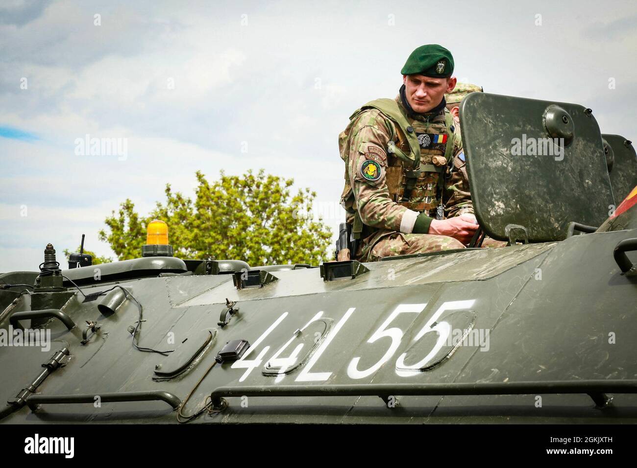 A Romanian soldier assigned to the Black Wolves, 151st Infantry ...