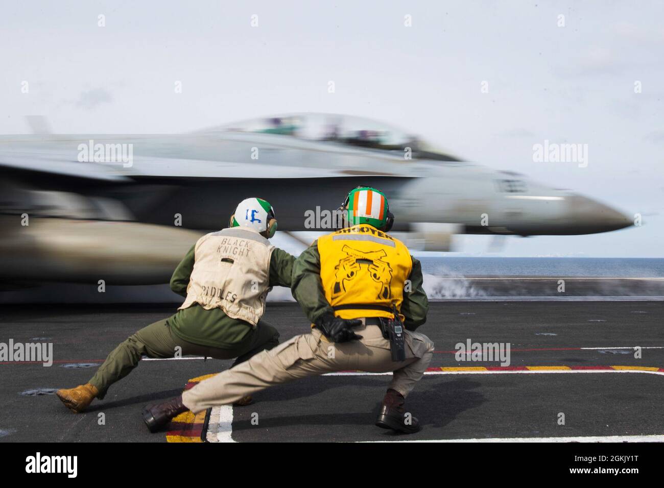 U.S. Navy Lt. Colin Zimmerman, right, a catapult officer aboard the ...