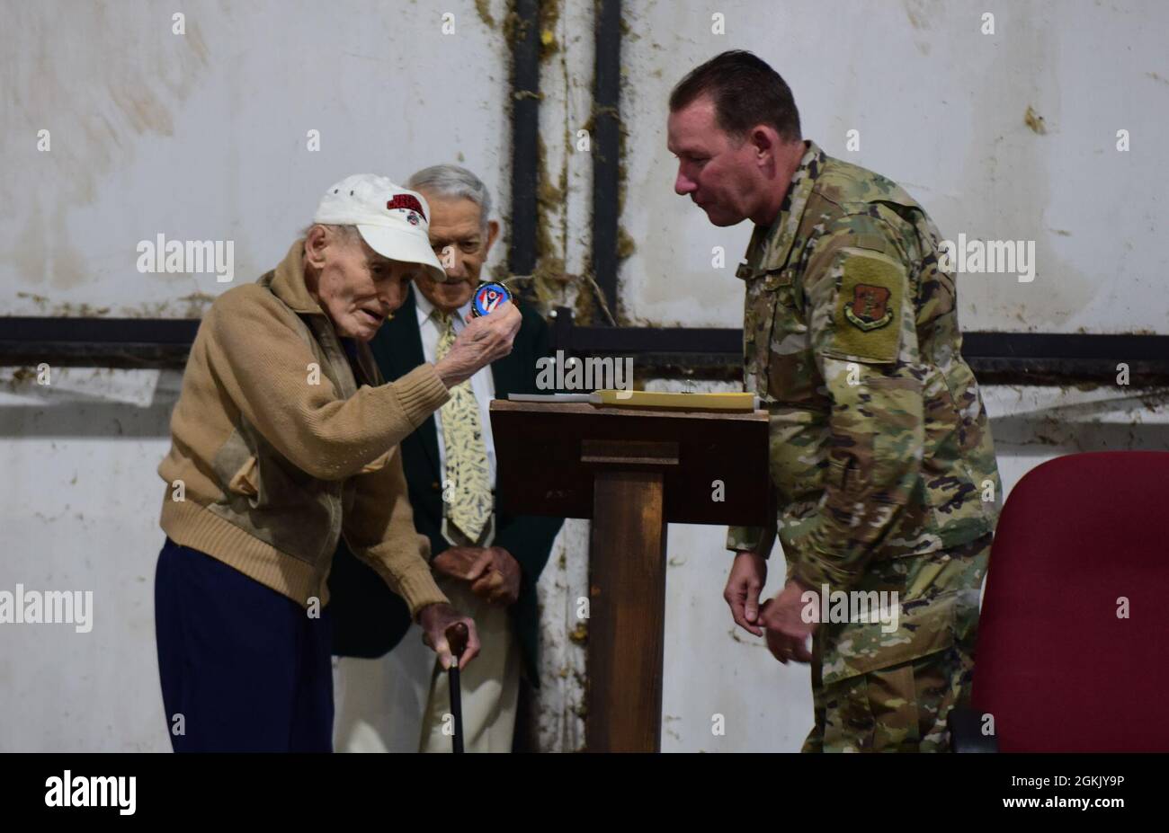 U.S. Air Force Lt. Col. (retired) Darrell Larkin shows the audience a ...