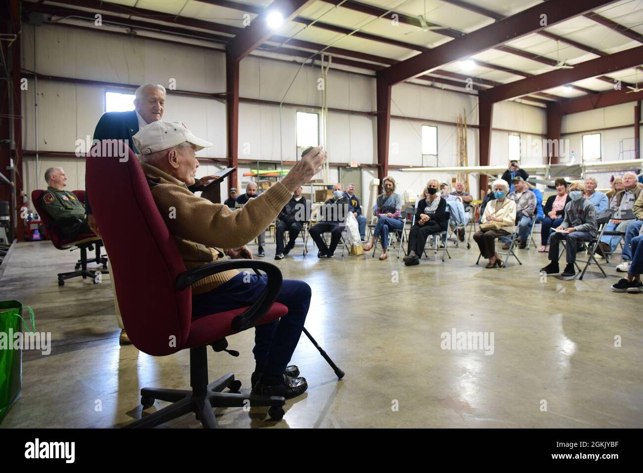 U.S. Air Force Lt. Col. (retired) Darrell Larkin shows the audience a ...