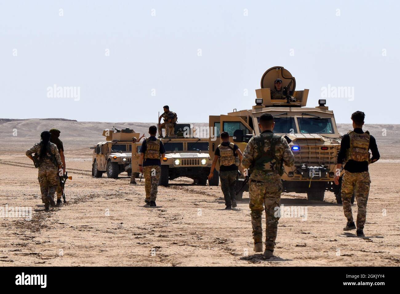 Syrian Democratic Force soldiers conduct a patrol during a joint ...