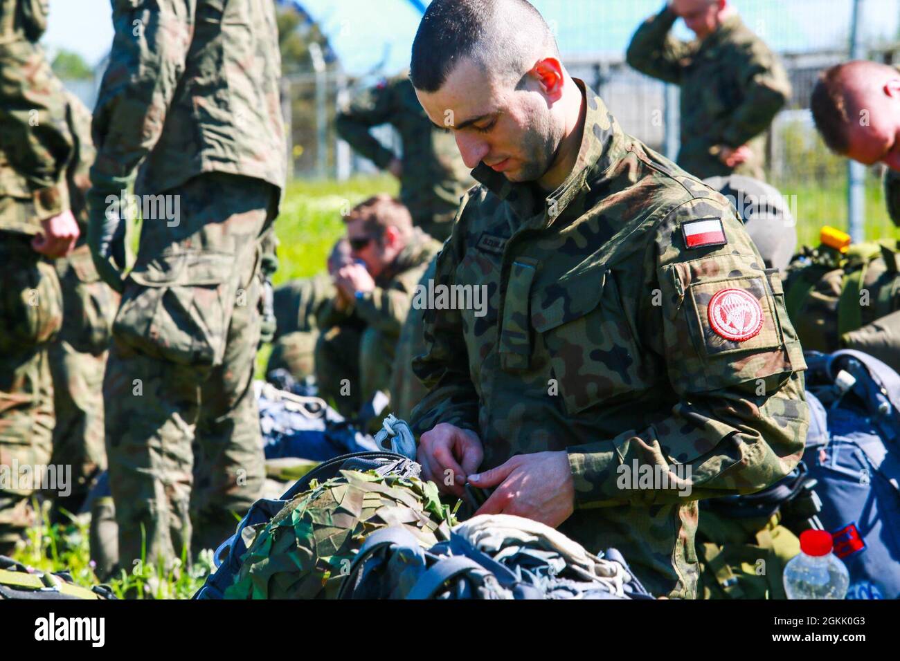 A Polish soldier assigned to the 16th Airborne Battalion prepares their ...