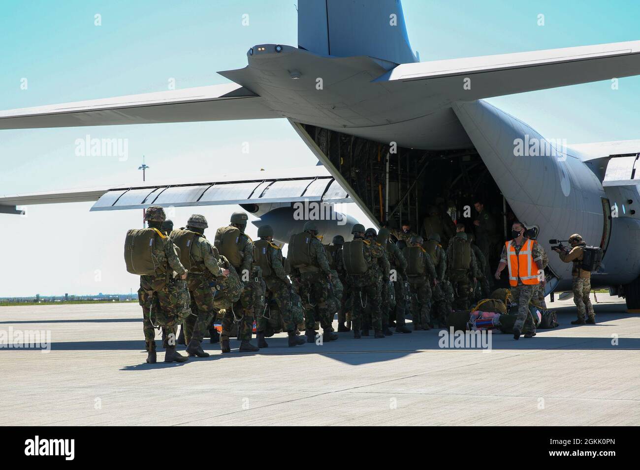 Netherlands soldiers assigned to 11th Airborne Battalion load onto a C ...