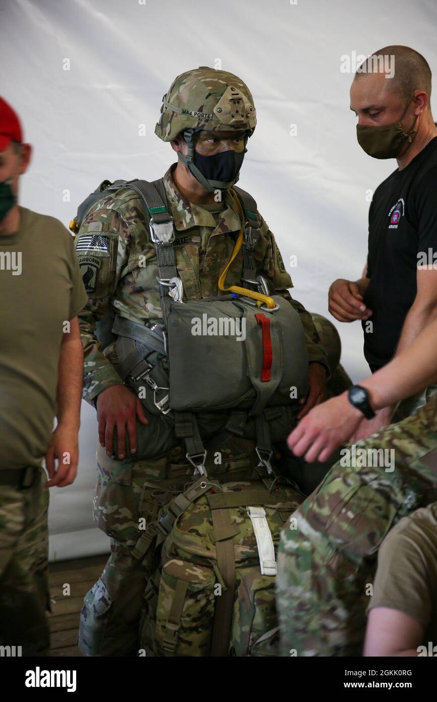 A U.S. Soldier assigned to 82nd Airborne Brigade awaits a parachute ...
