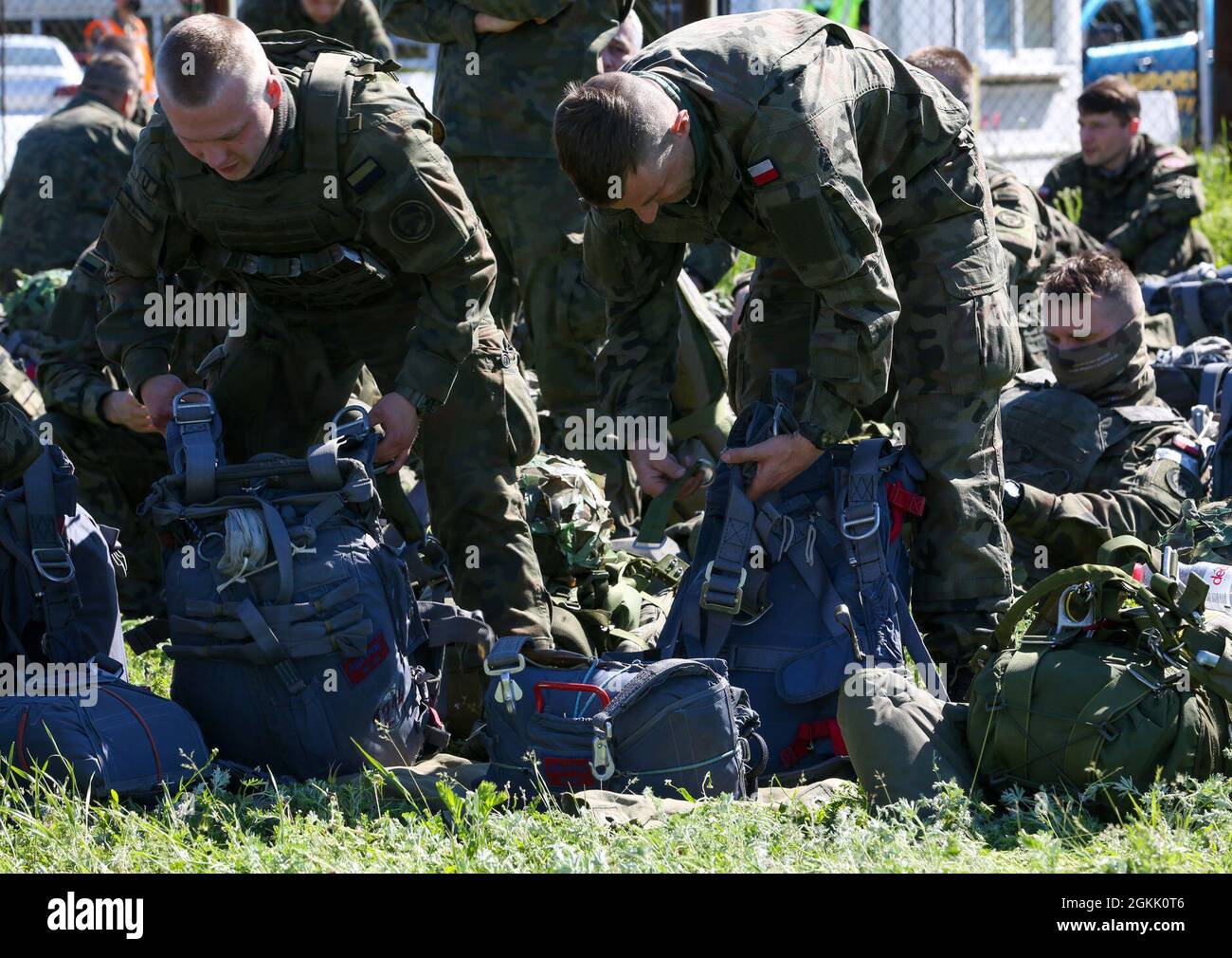 Polish paratroopers assigned to the 16th Airborne Battalion check their ...